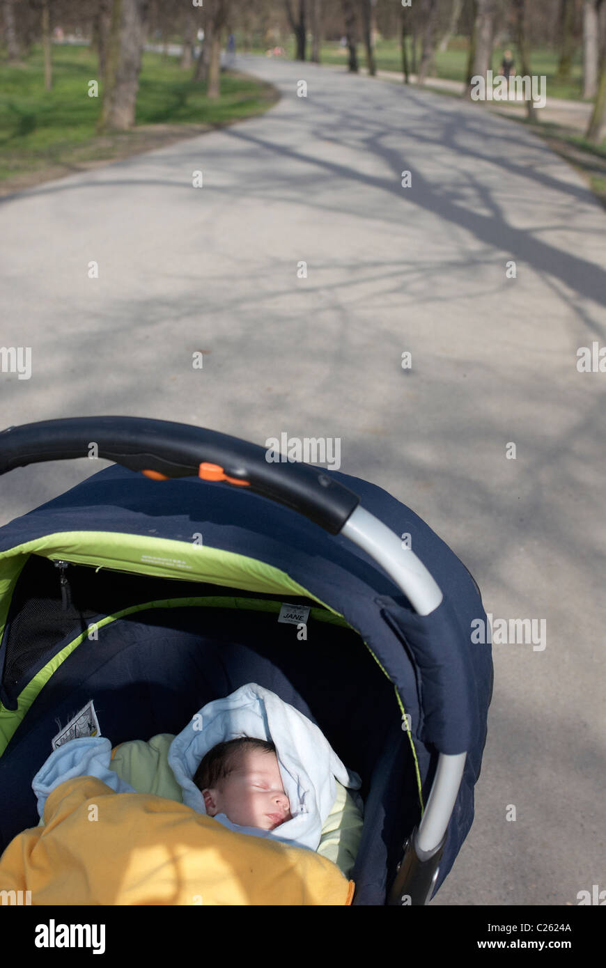 Child baby girl in buggy - pram - outside Stock Photo - Alamy