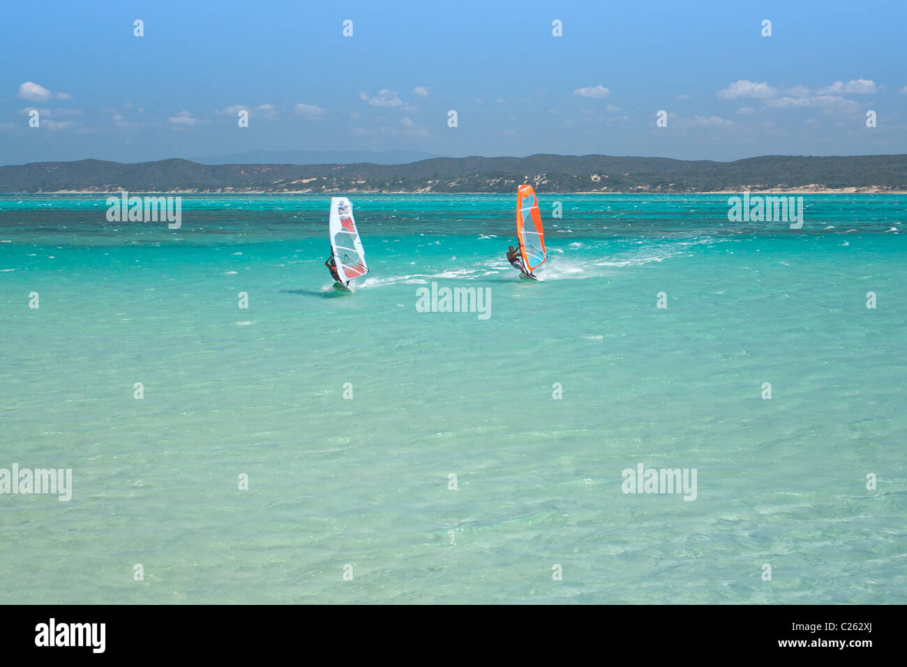 Couple man and woman windsurfing in the lagoon Stock Photo - Alamy