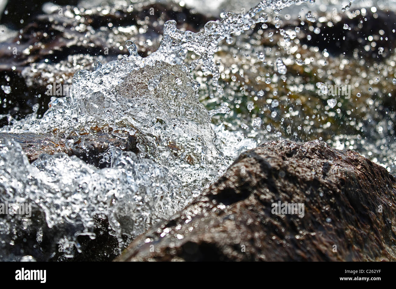 Photo of water crashing over rocks Stock Photo - Alamy