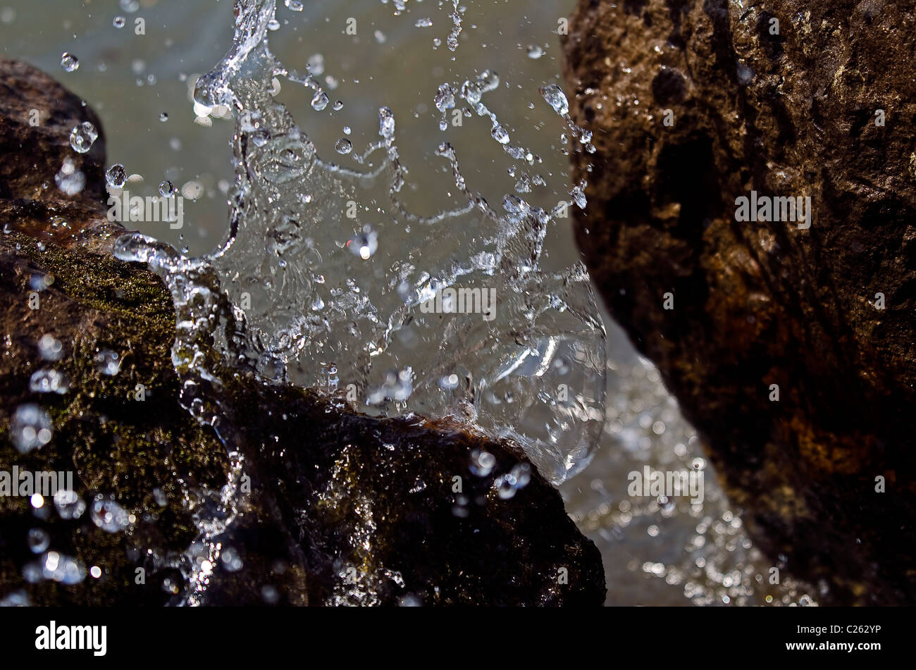 Water crashes against the rocks Stock Photo - Alamy
