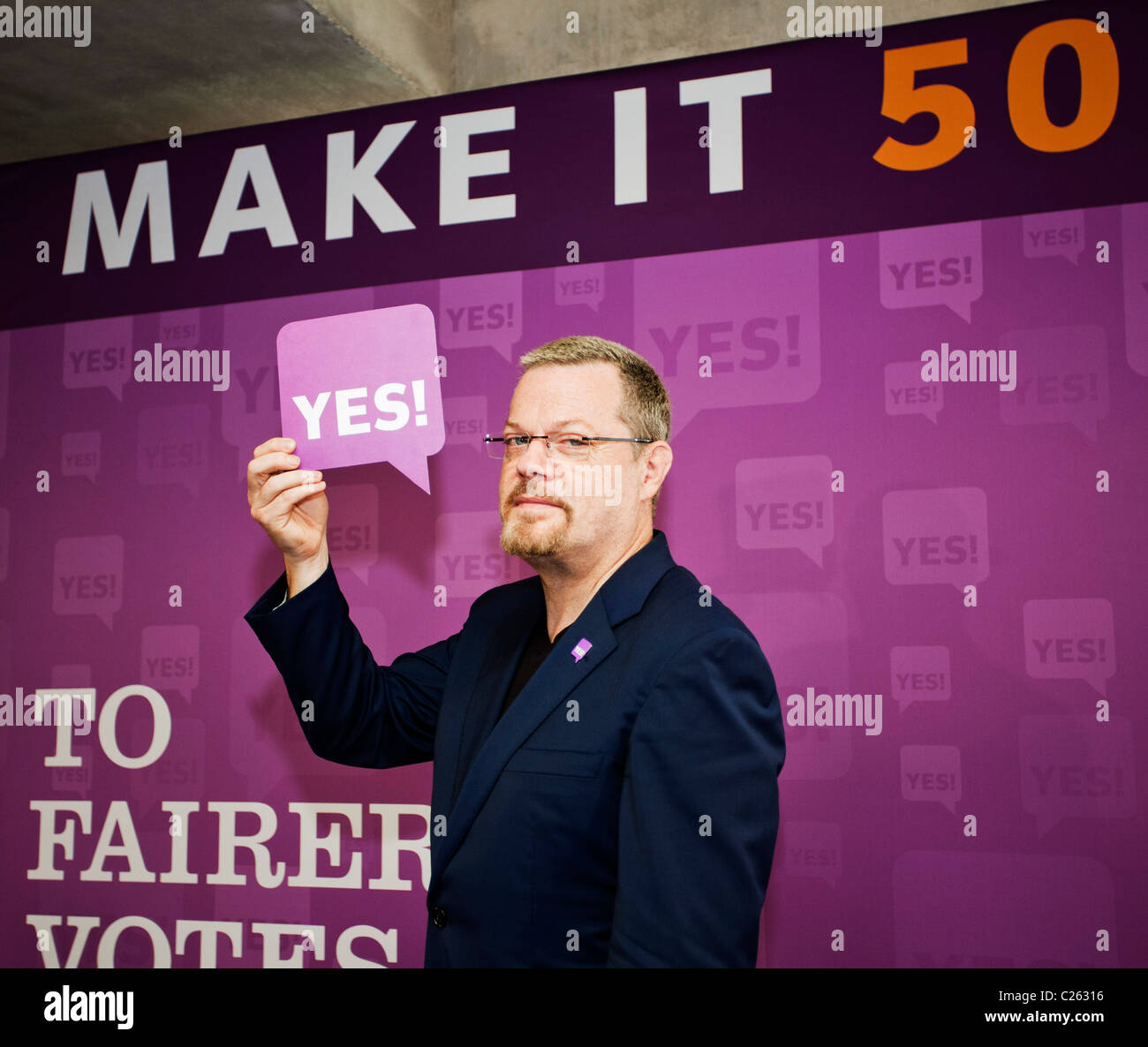 Eddie Izzard holds up a YES! card as he shows his support for the YES ...