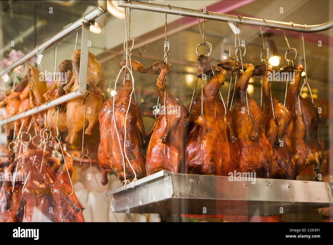 Roast duck hanging in a Chinese restaurant window Stock Photo - Alamy