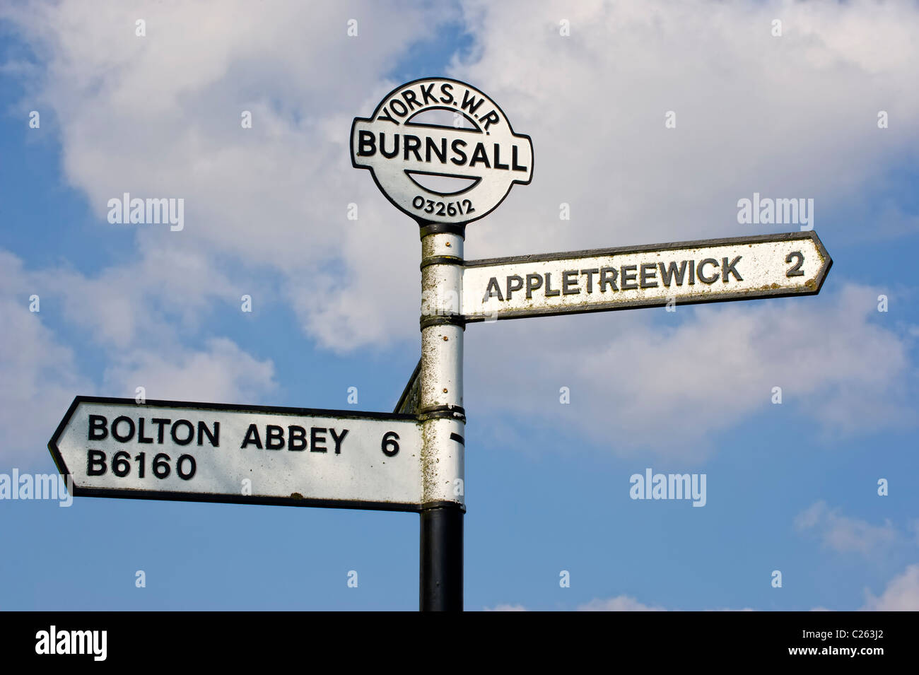 Old metal road sign in Burnsall in Yorkshire, England Stock Photo - Alamy