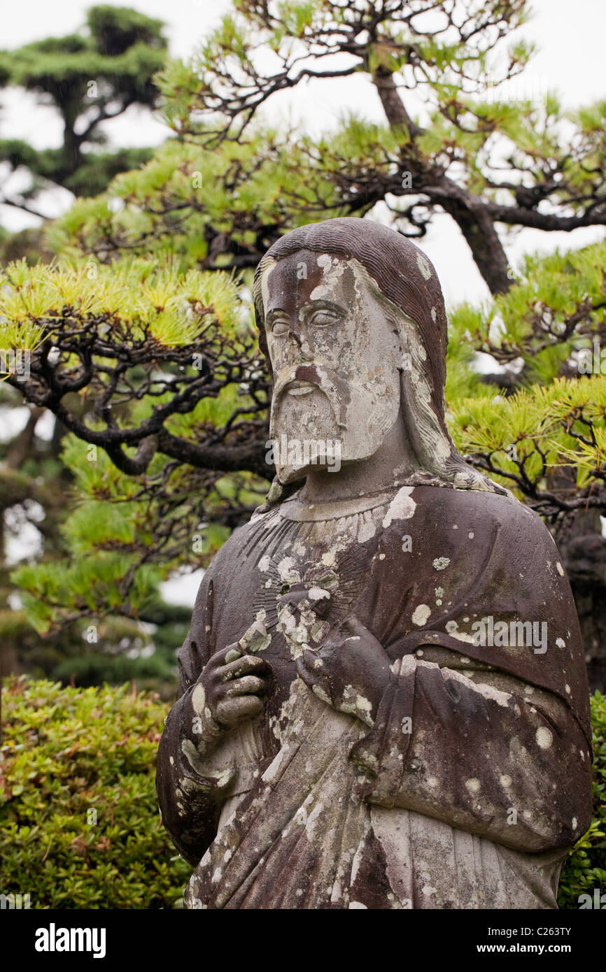 Closeup of statue, wet with rain, on grounds of Urakami Cathedral ...
