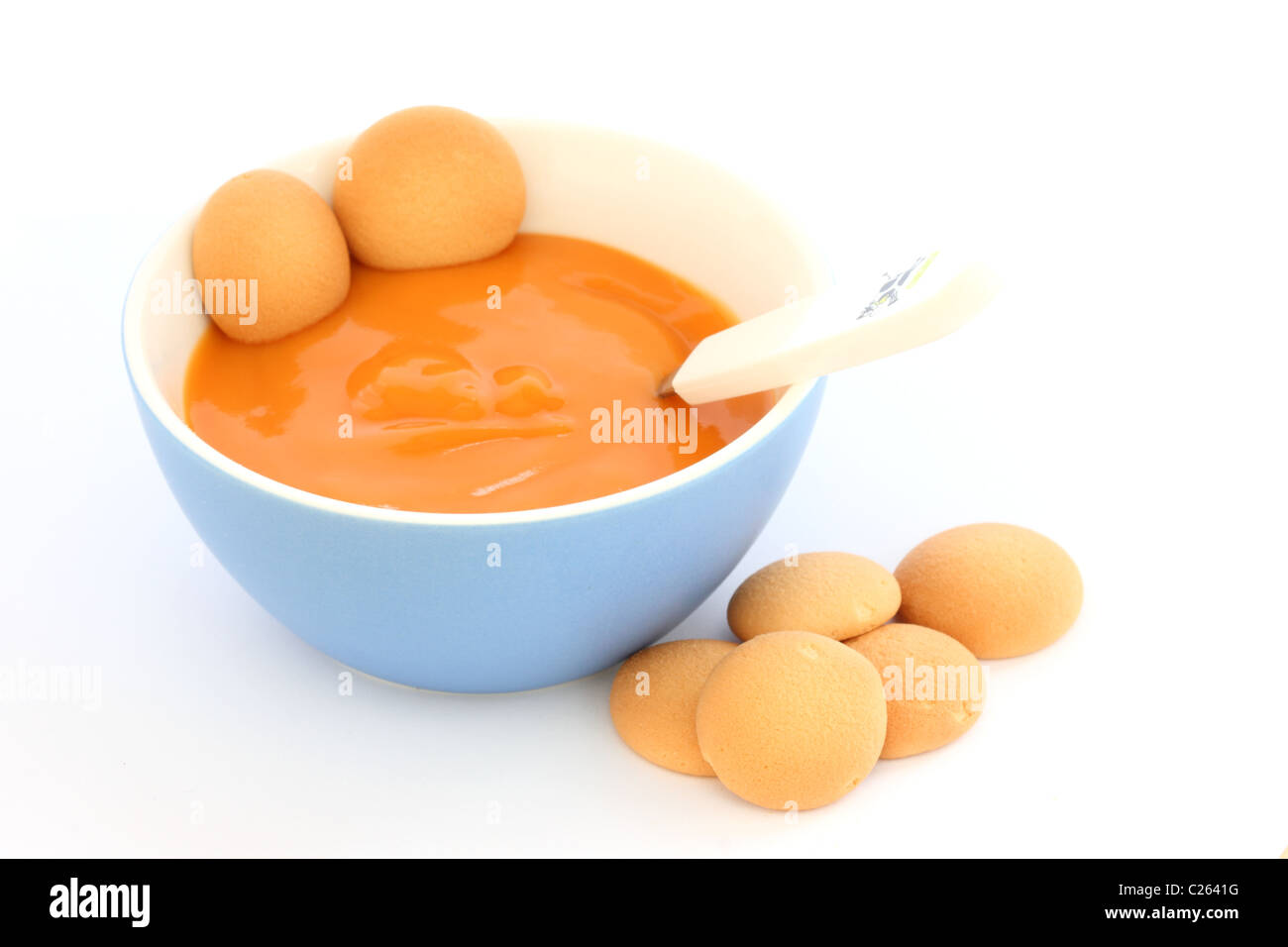 Close up view of hot baby fruit pap /mush in blue bowl - with several ...