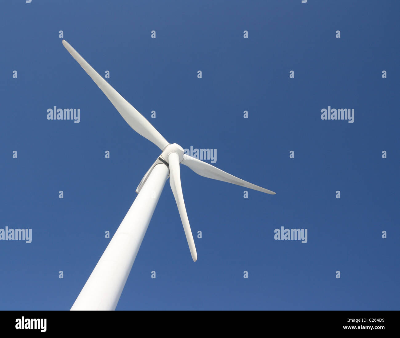 View of single windmill generating electricity against blue sky Stock ...