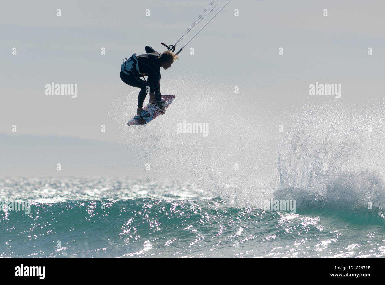 kitesurfer jumping in the air Stock Photo - Alamy