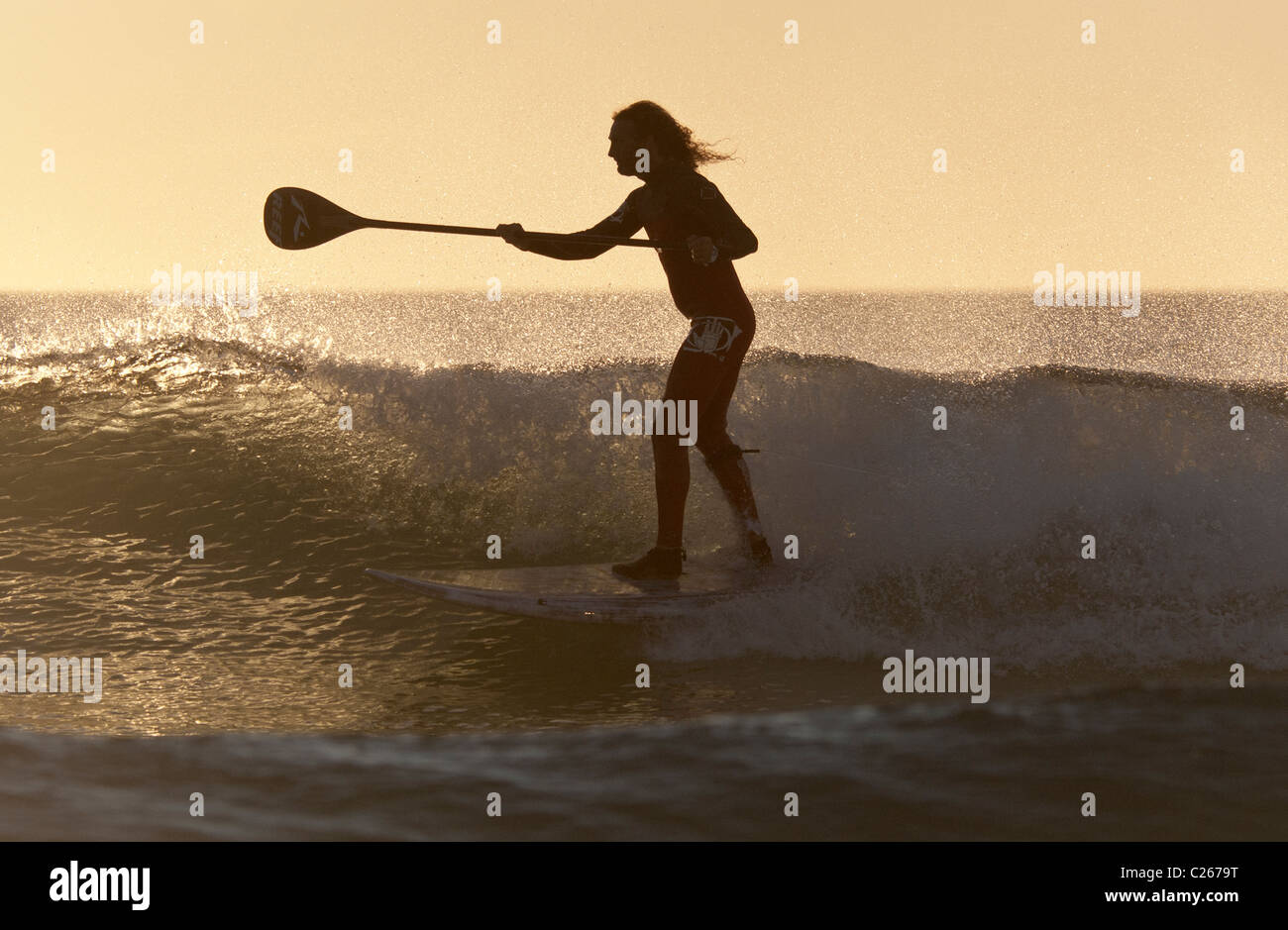 Stand up paddle surfing Stock Photo - Alamy