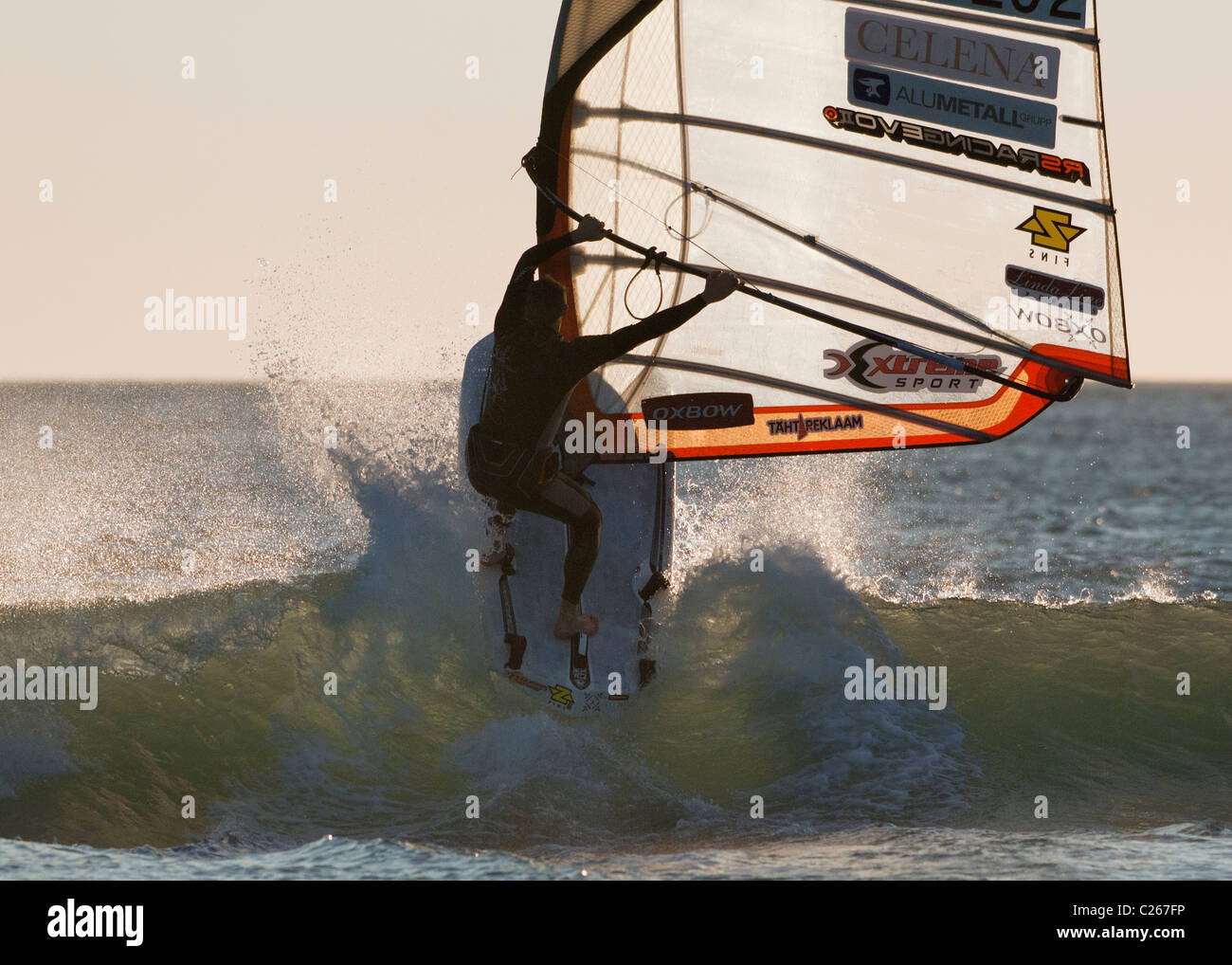 windsurfer jumping a wave Stock Photo - Alamy