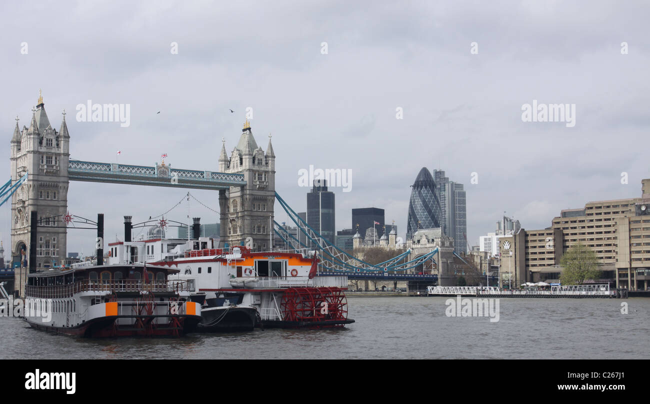 Paddle steamers on River Thames with Tower Bridge and London skyline ...