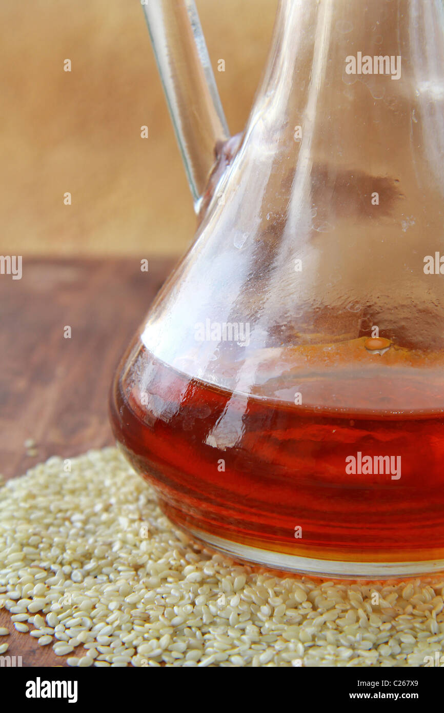 sesame seeds and sesame oil in a bottle Stock Photo - Alamy