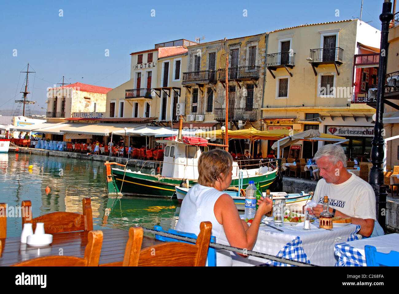 Rethymnon Harbour restaurant in Crete, Greece Stock Photo - Alamy