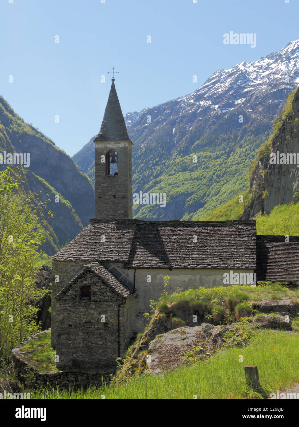 cute, little church built from raw stone standing amidst fresh spring ...