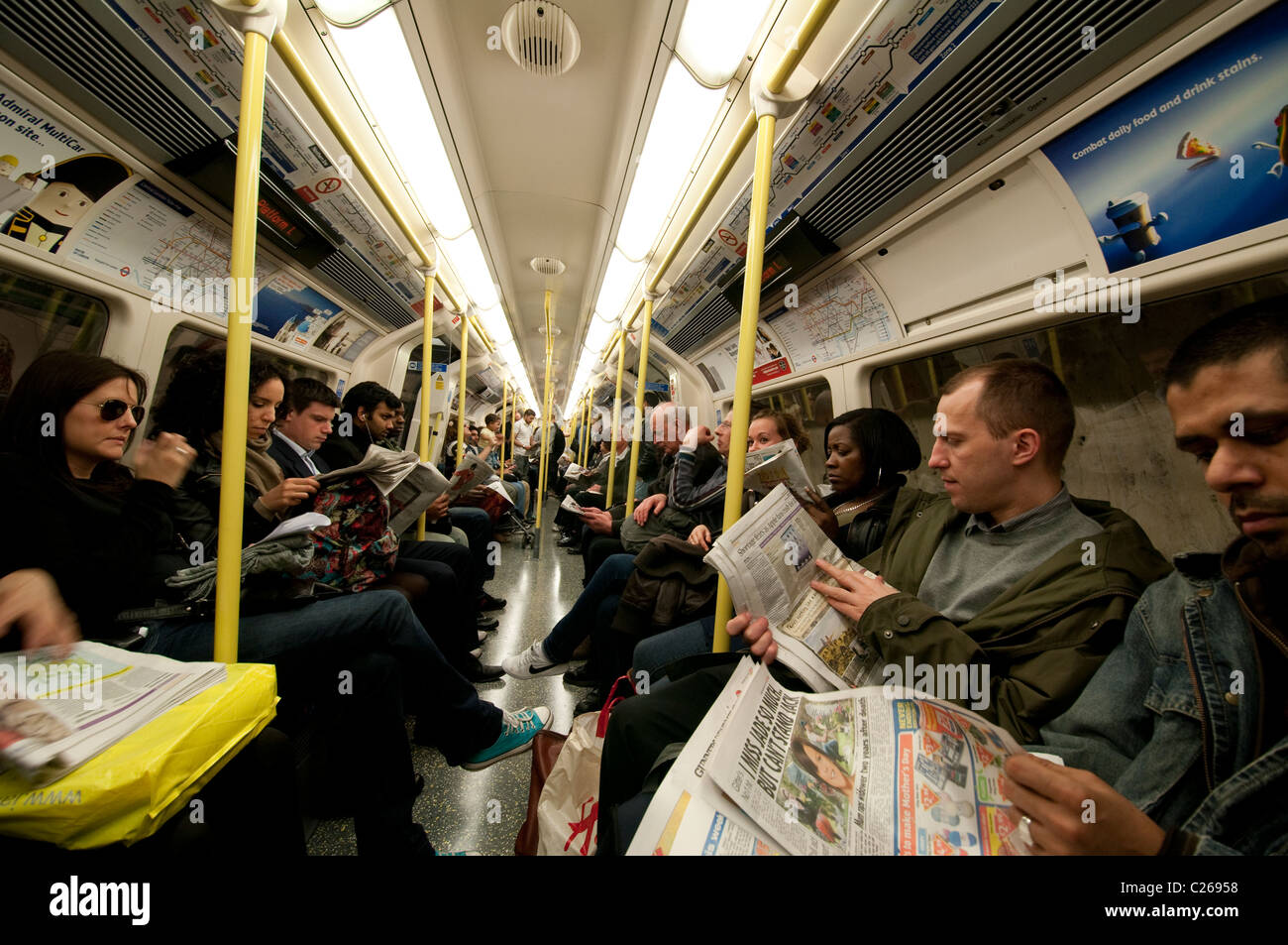 Passengers commuting on London underground tube Stock Photo - Alamy