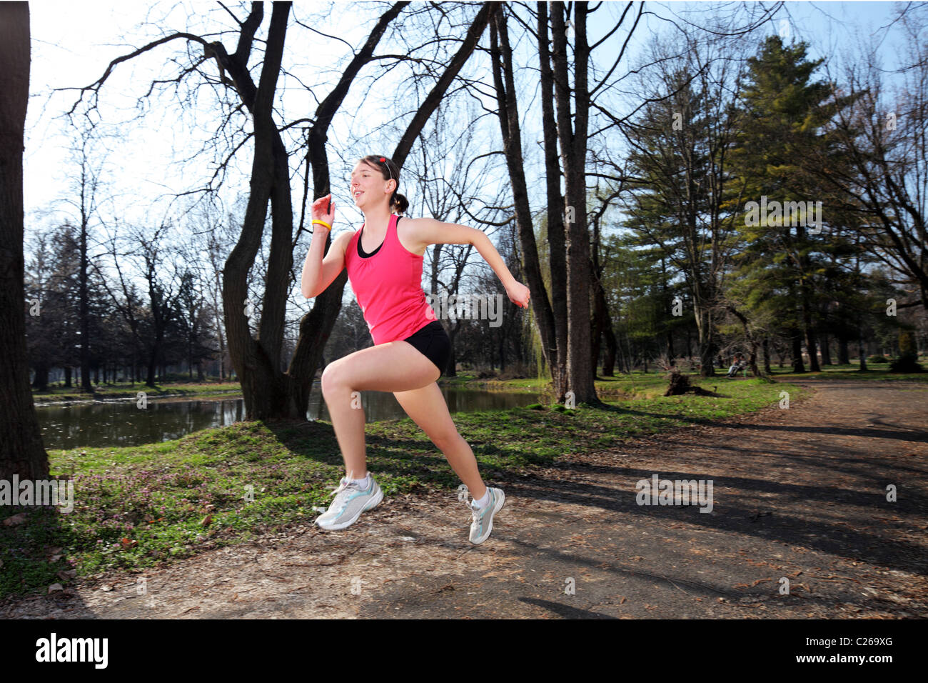 Panning shot of a female runner running Stock Photo - Alamy