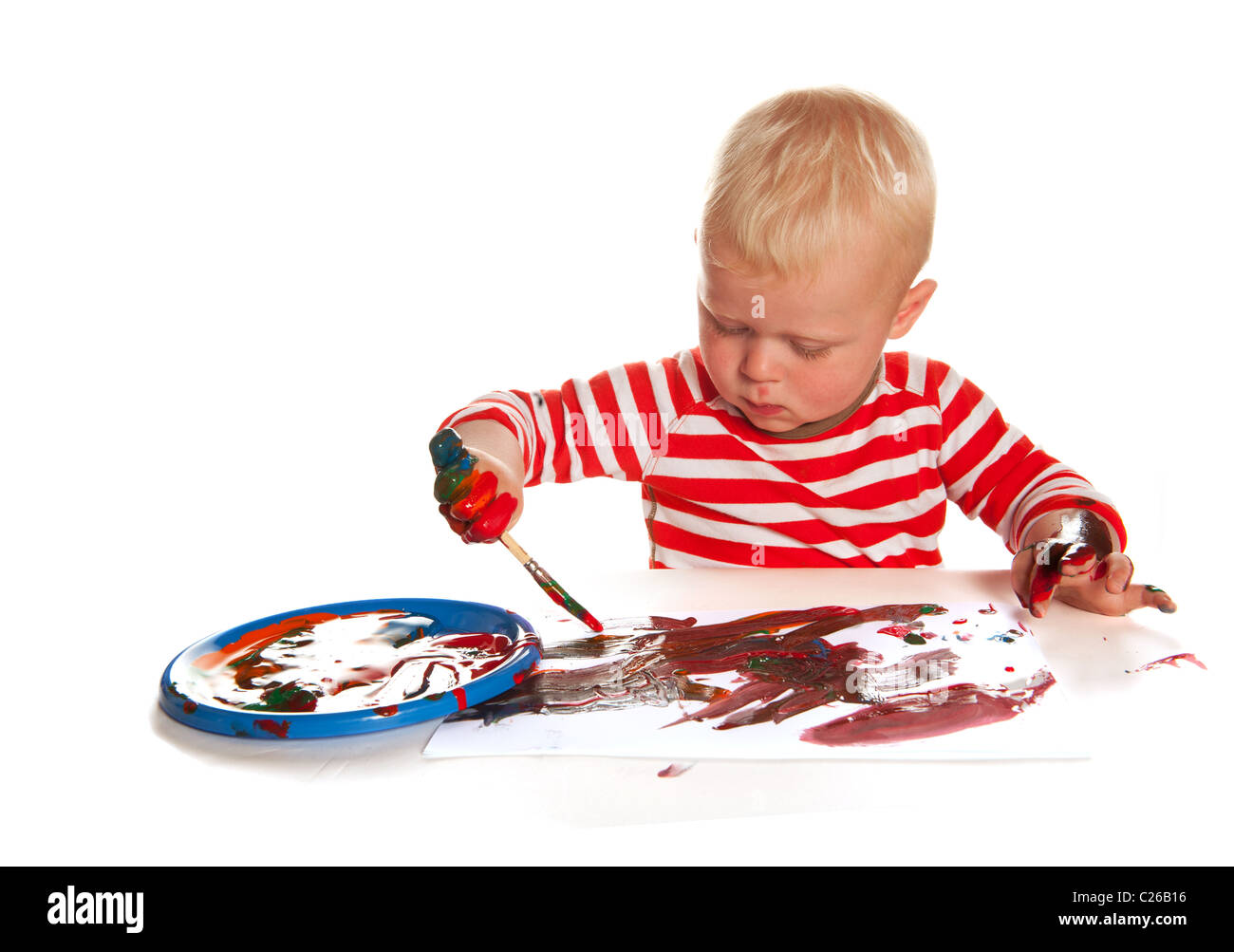 Little boy is painting and making a mess Stock Photo - Alamy