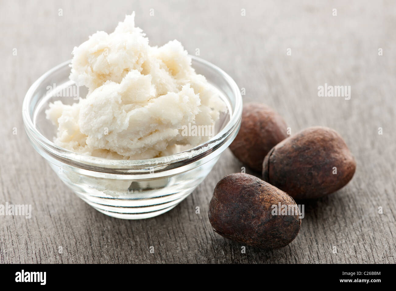 Shea nuts and sheabutter in glass bowl Stock Photo - Alamy