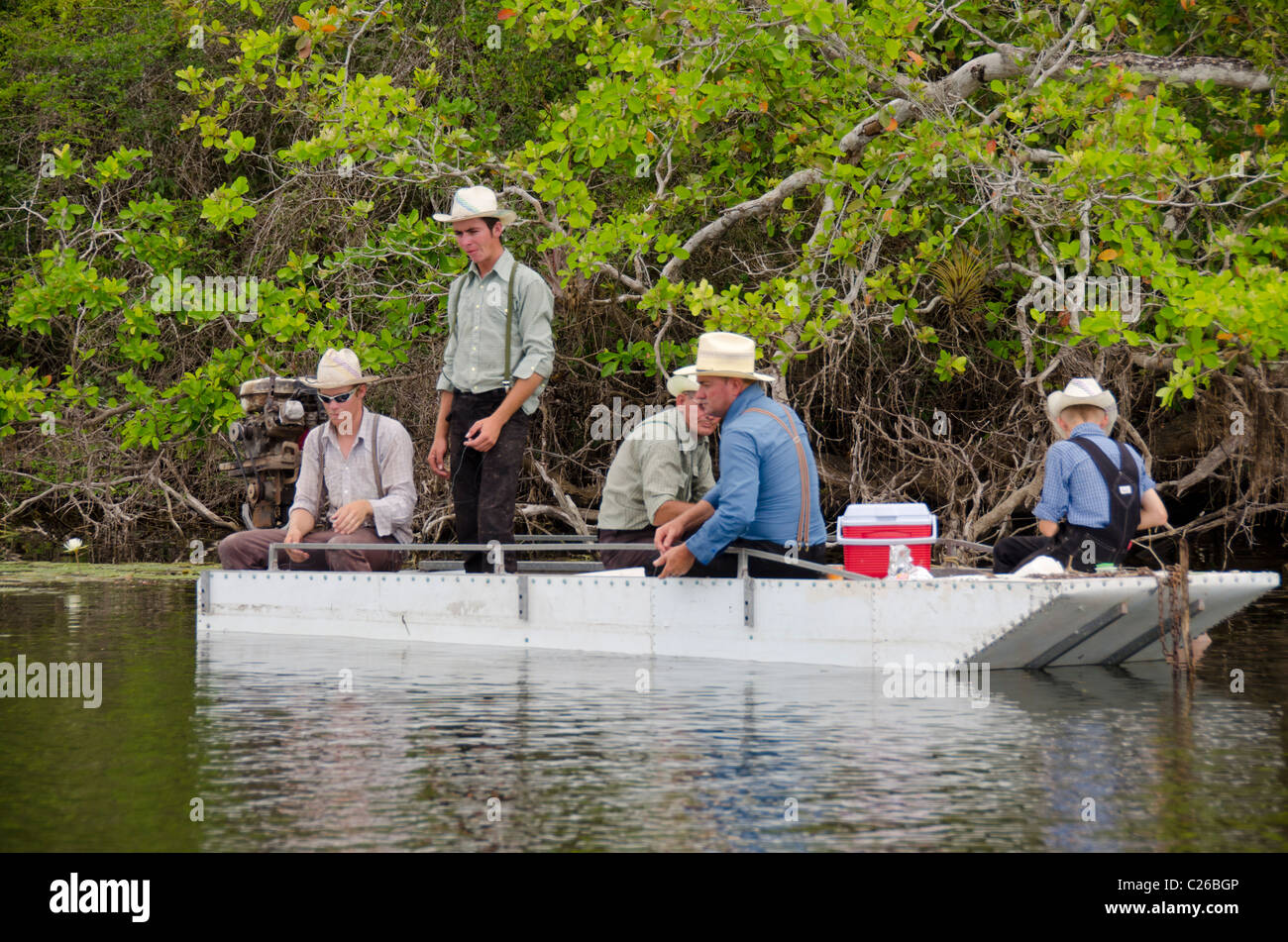 Central America, Belize. Mennonite fisherman in traditional attire ...