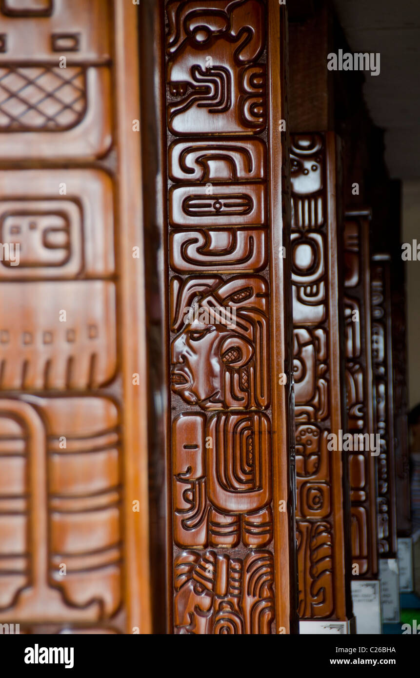 Central America, Belize. Belize City. Hand carved Mayan motif wooden ...