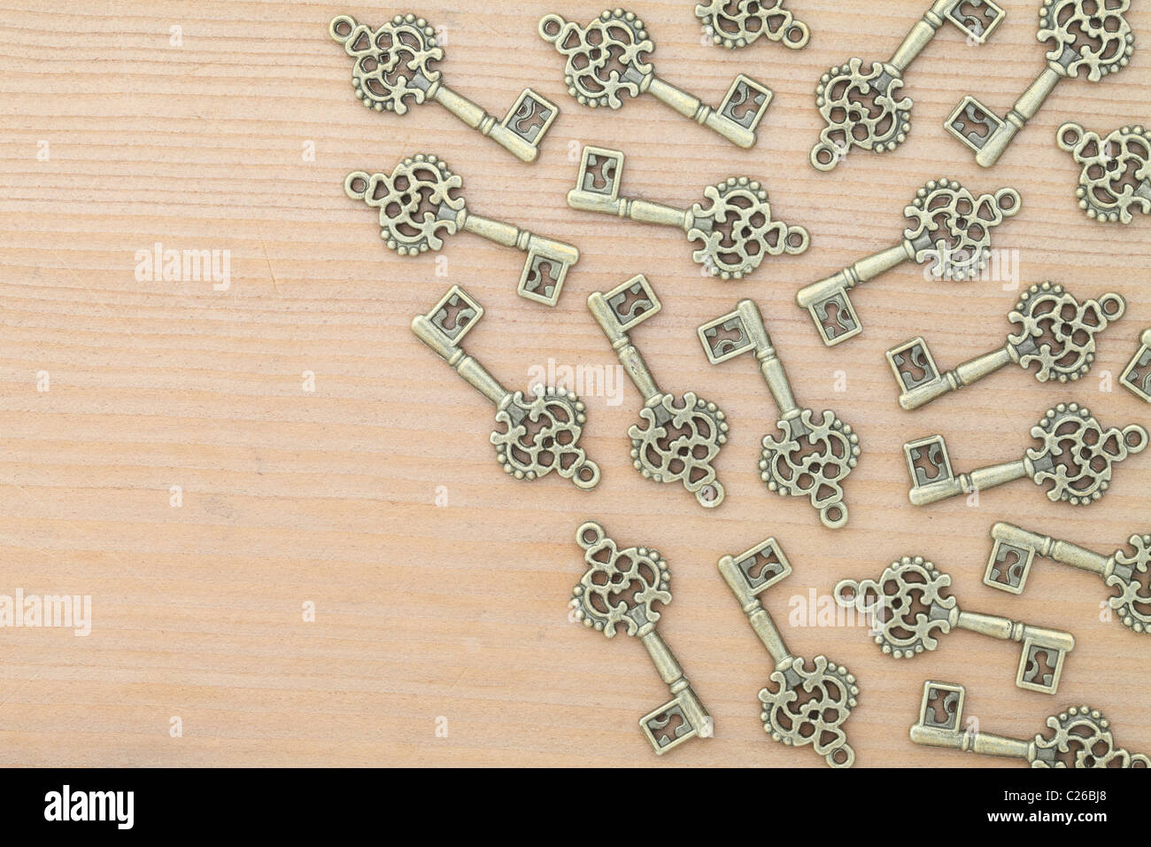 Old keys on wooden table Stock Photo - Alamy