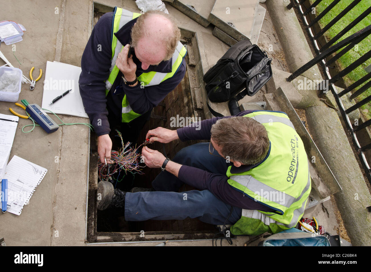BT Telephone engineers in manhole repairing telephone cables and wires ...