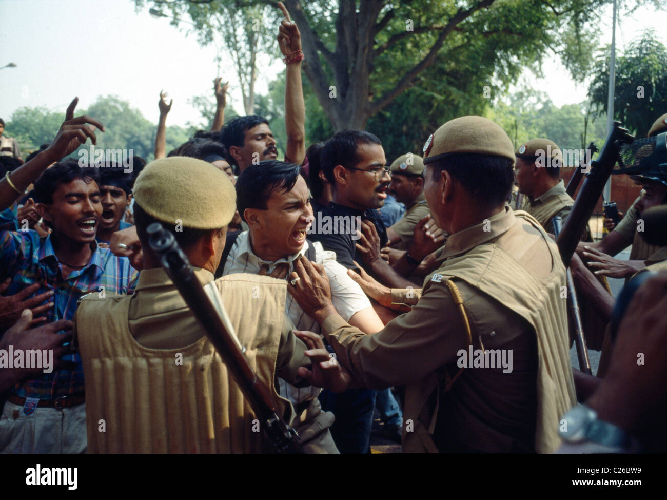 Students protest in front of a police barricade near Indian parliament ...