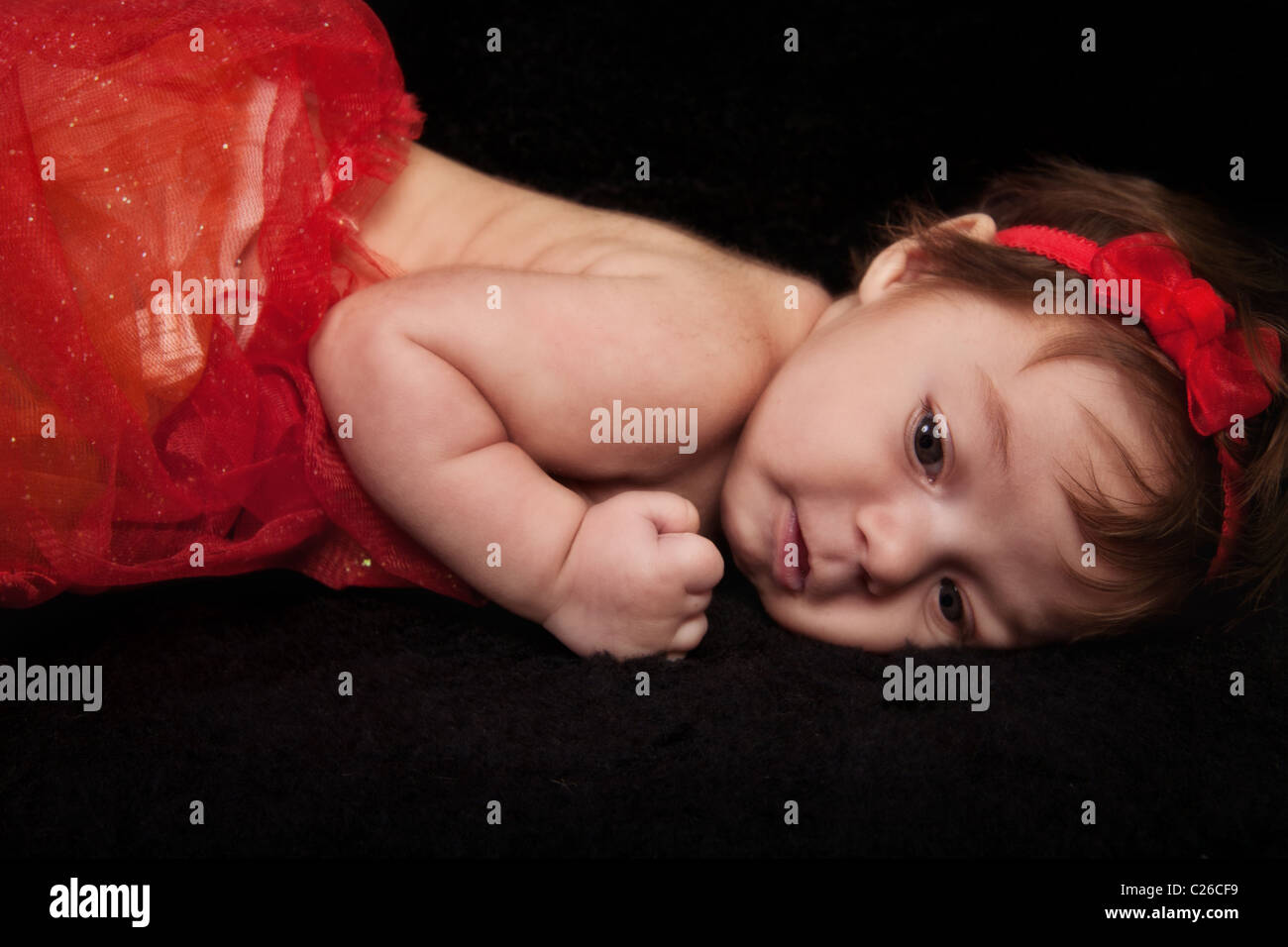 cute infant baby girl with red bow and red tutu Stock Photo - Alamy