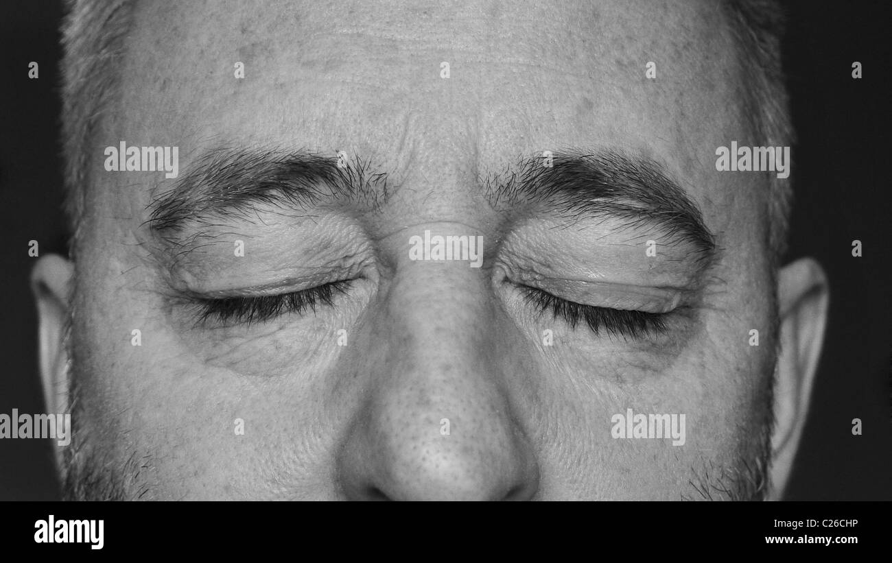 Close-up of day dreaming man with eyes closed Stock Photo - Alamy