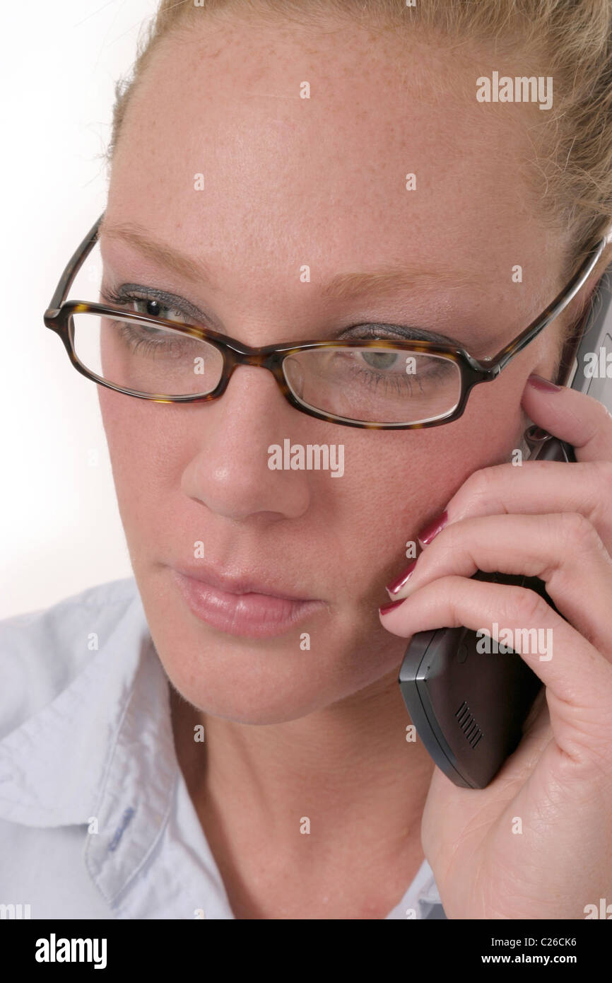 attractive business woman wearing glasses and talking on cellphone ...