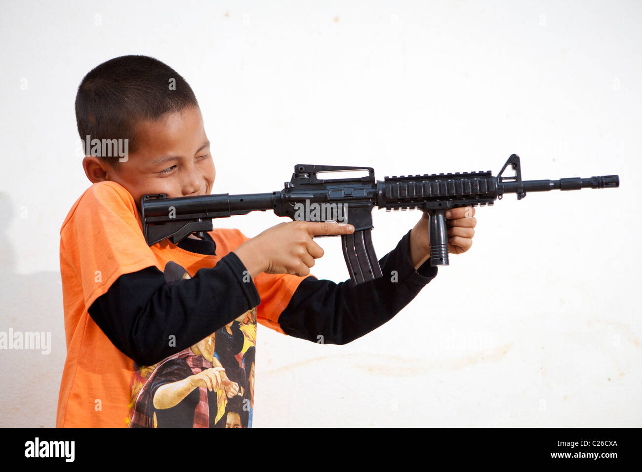 Boy with rifle hi-res stock photography and images - Alamy
