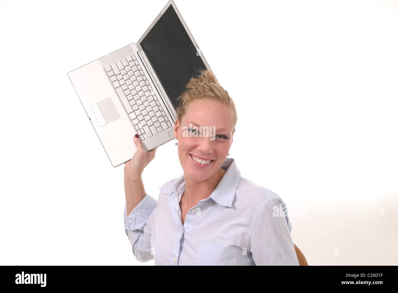 Smiling but possibly frustrated young woman seriously considering ...