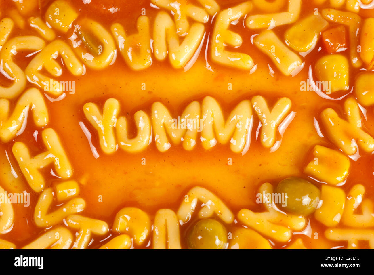 Alphabet shaped pasta forming the word YUMMY in tomato sauce Stock ...
