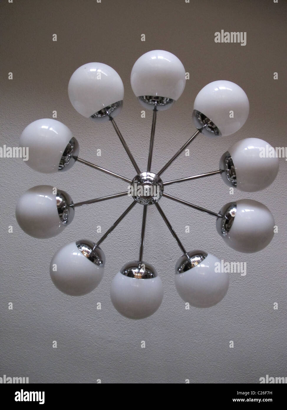 Symmetrical lamp that simulates a spaceship or a luminous wheel Stock ...