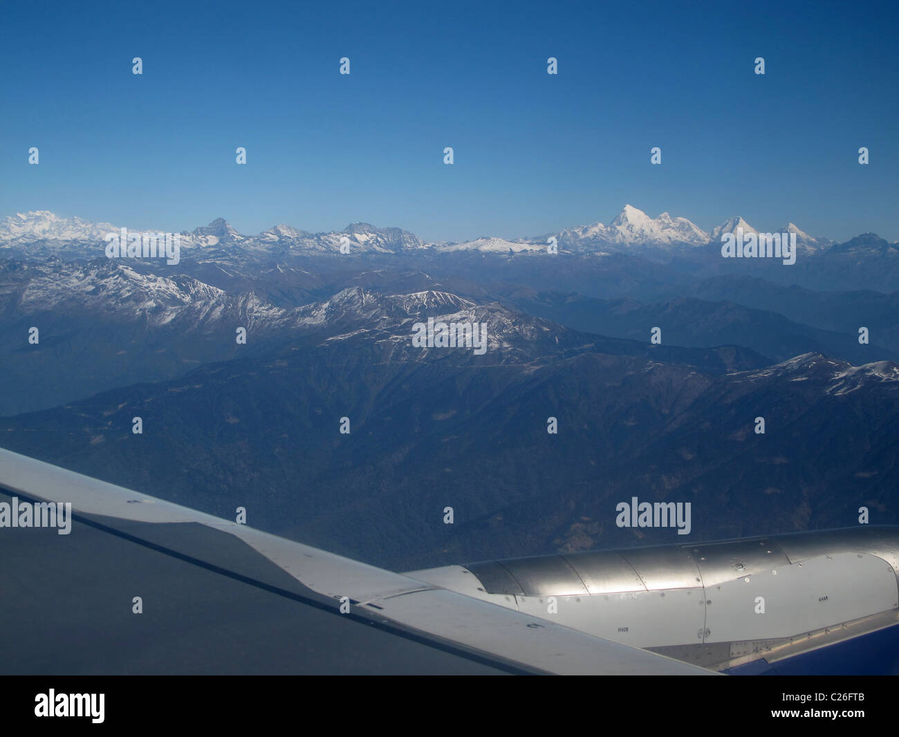 View over the Himalaya mountains from a Druk Air flight in an Airbus ...