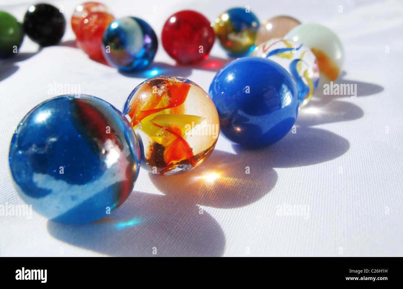 Crystal balls in a row on a white background Stock Photo - Alamy