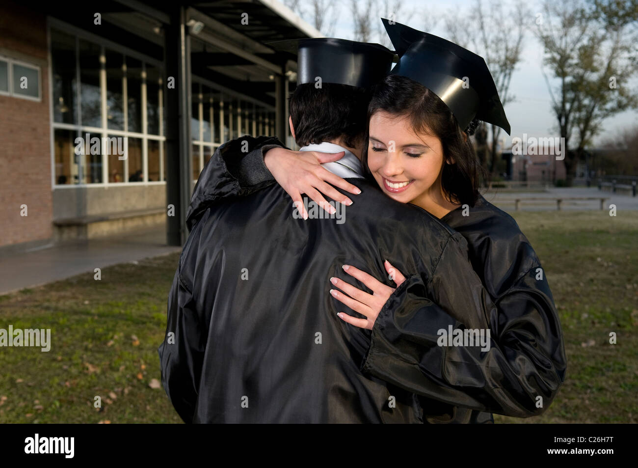 Student, being, huged, hug, hugging, at, gratuation, at, campus, at ...