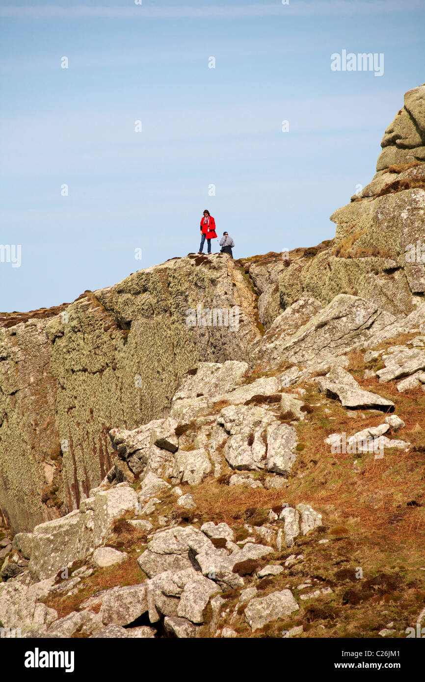 Couple playing the letterbox game looking for the letterbox in the area ...