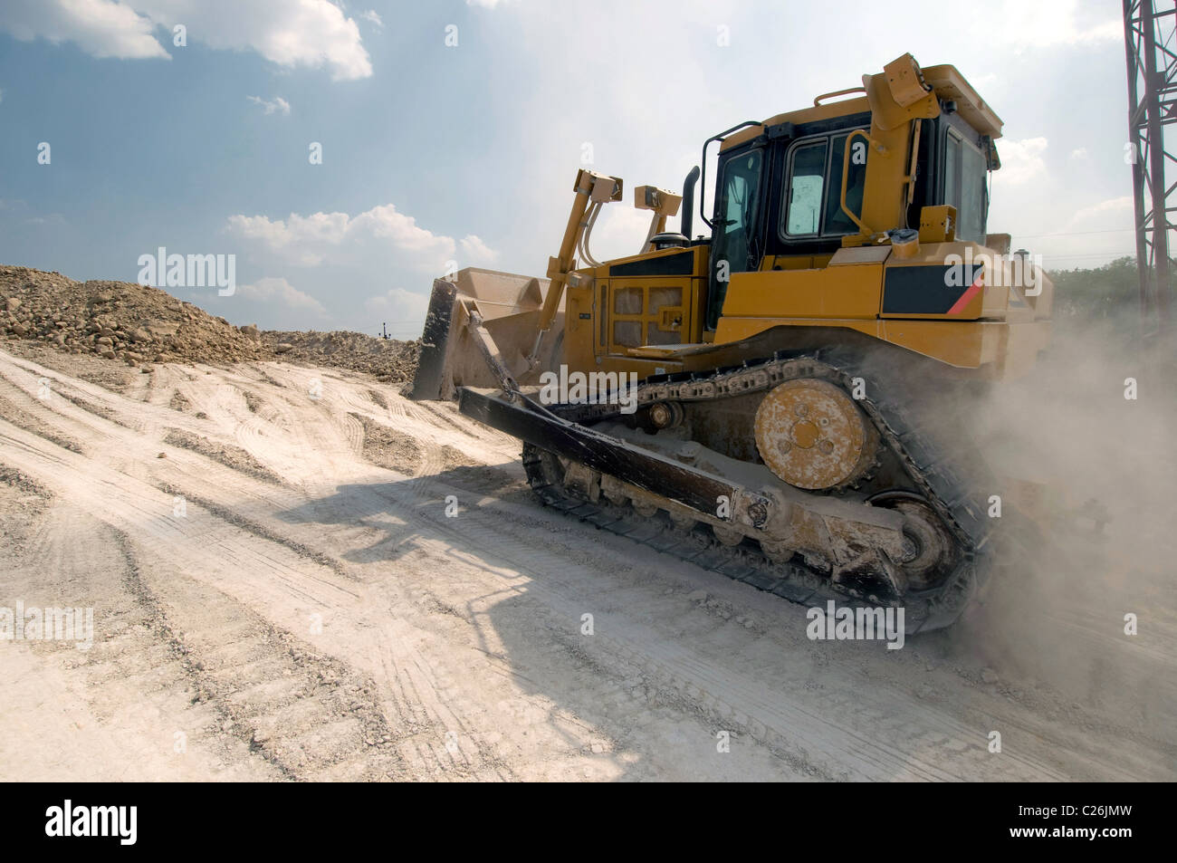 loading machine produces crushed stone for a career Stock Photo - Alamy