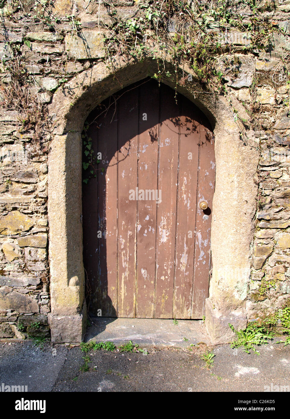 Old rustic door through stone wall, UK Stock Photo - Alamy