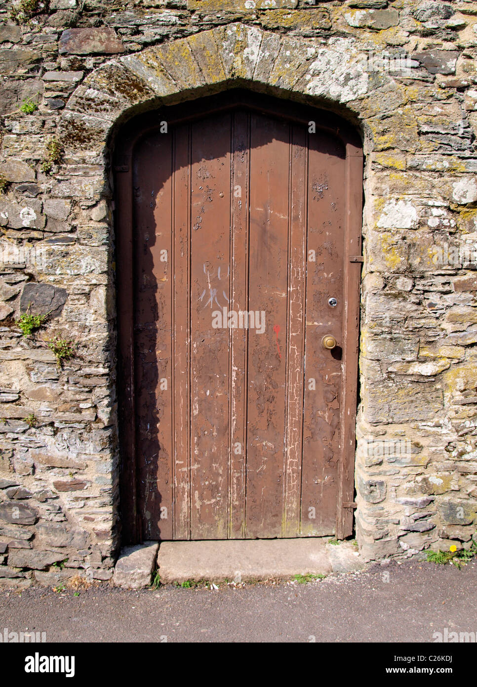 Old rustic door through stone wall, UK Stock Photo - Alamy