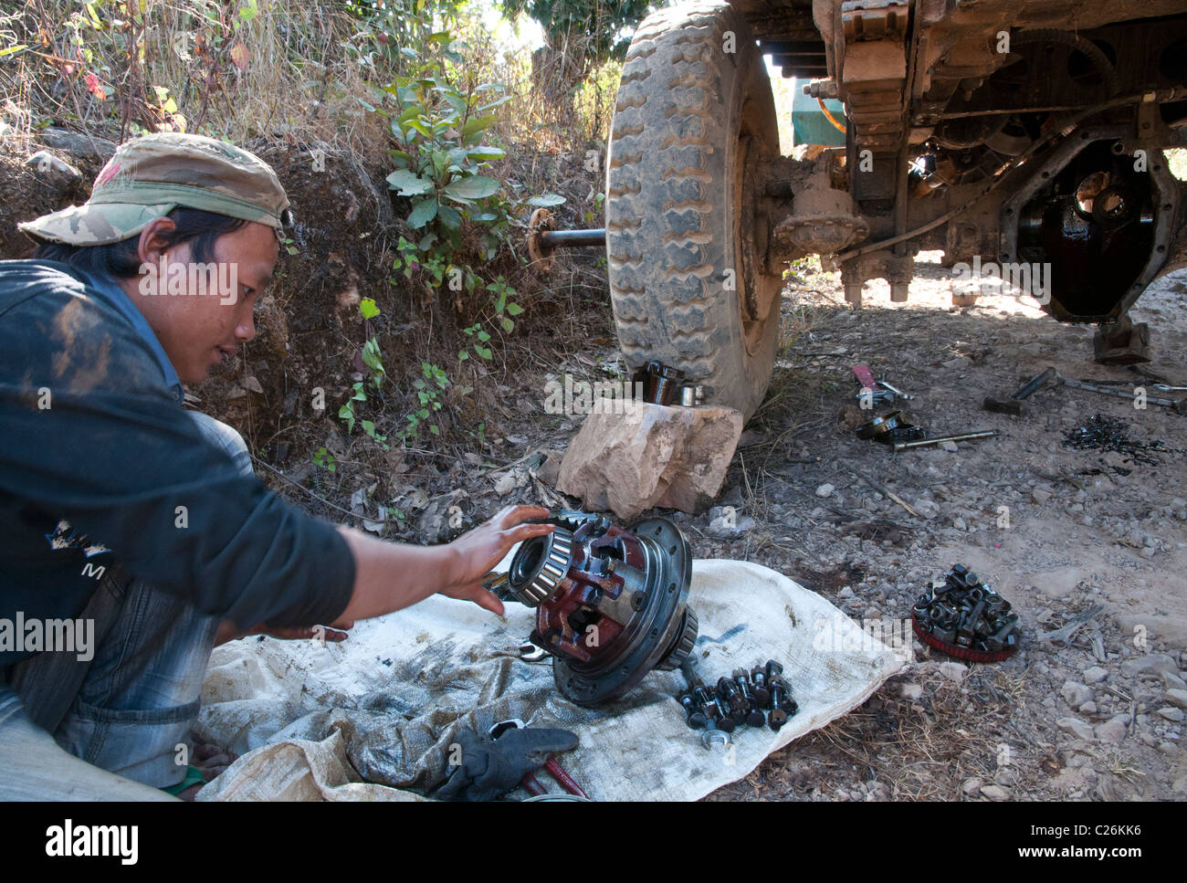 mechanic fixing a truck on the road. Northern Shan State. Myanmar Stock ...