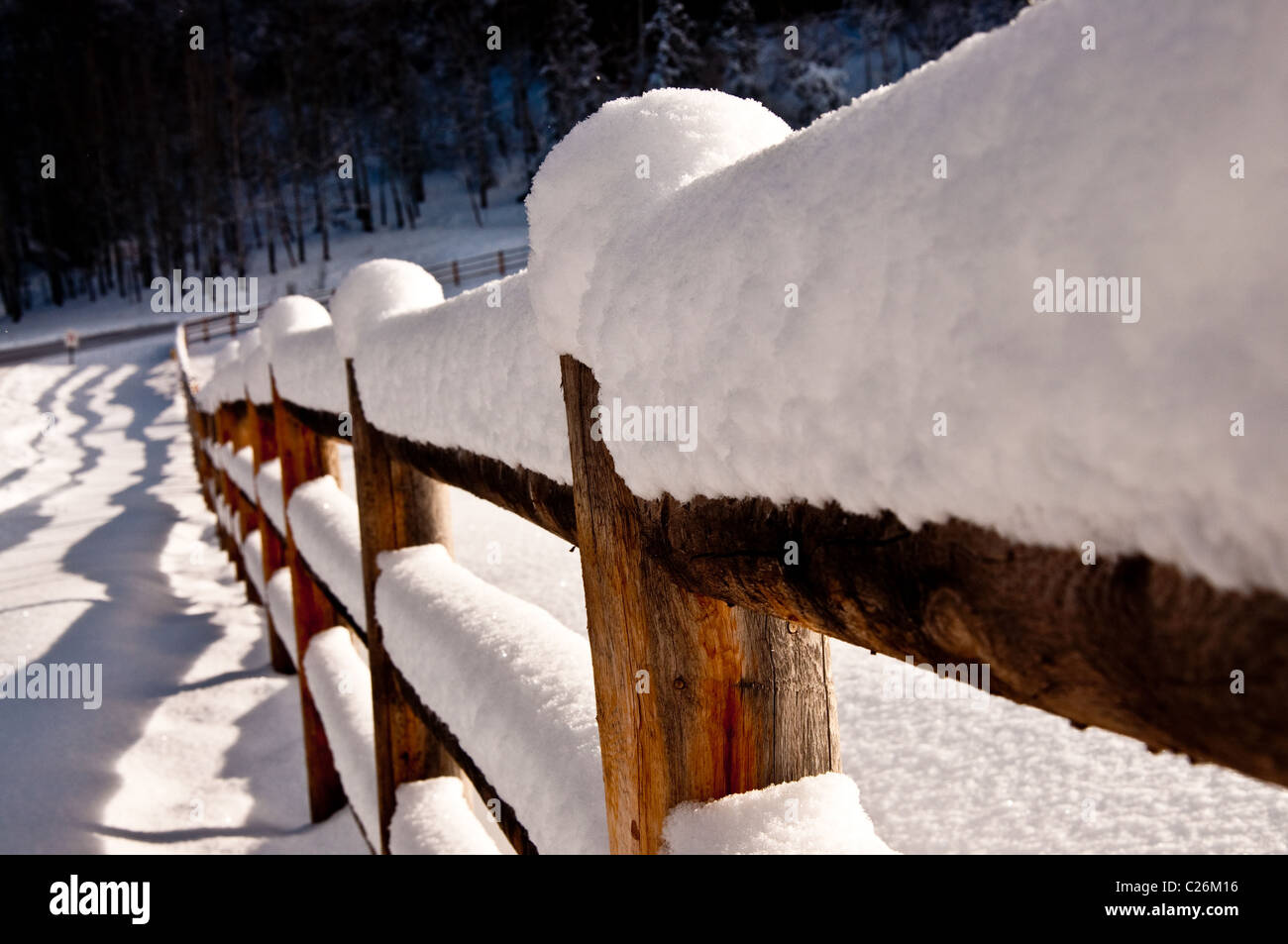 A snow covered wooden fence Stock Photo - Alamy