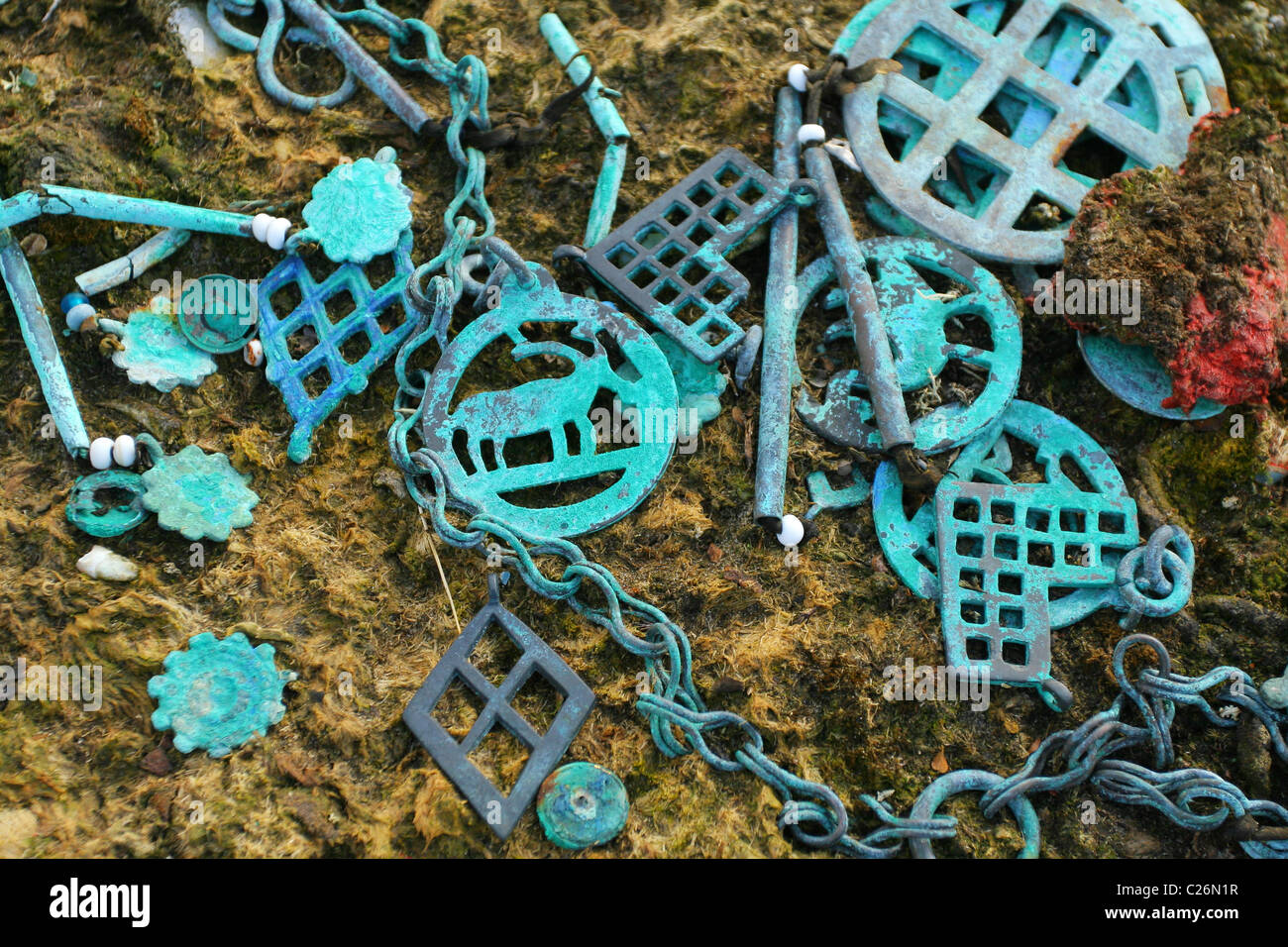 Copper pectoral in the open tomb in the Nenets cemetery (halmer) in the ...