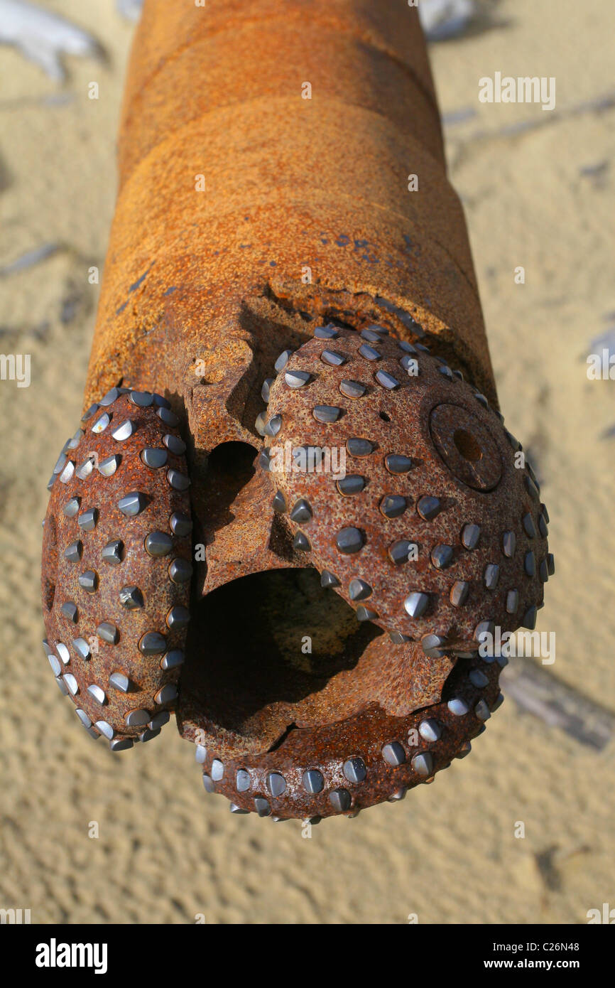 Rusty drill bit with three cutters on the end. Yamal peninsula, RUSSIA ...