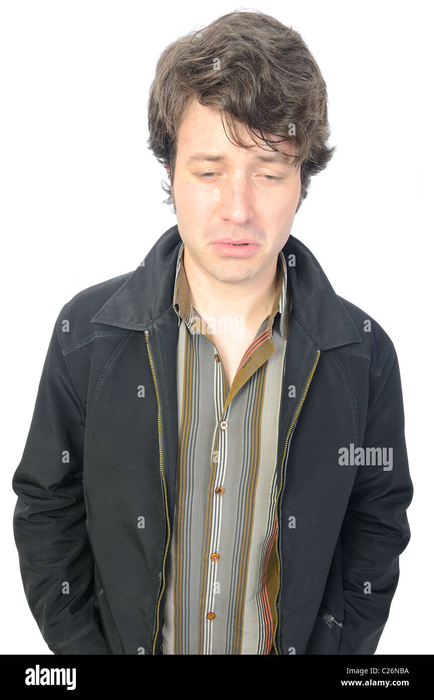 An adult male with a sad look on his face Stock Photo - Alamy