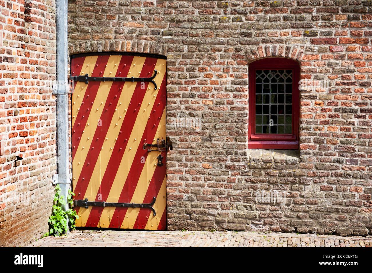 Detail of an ancient castle with door and window Stock Photo - Alamy