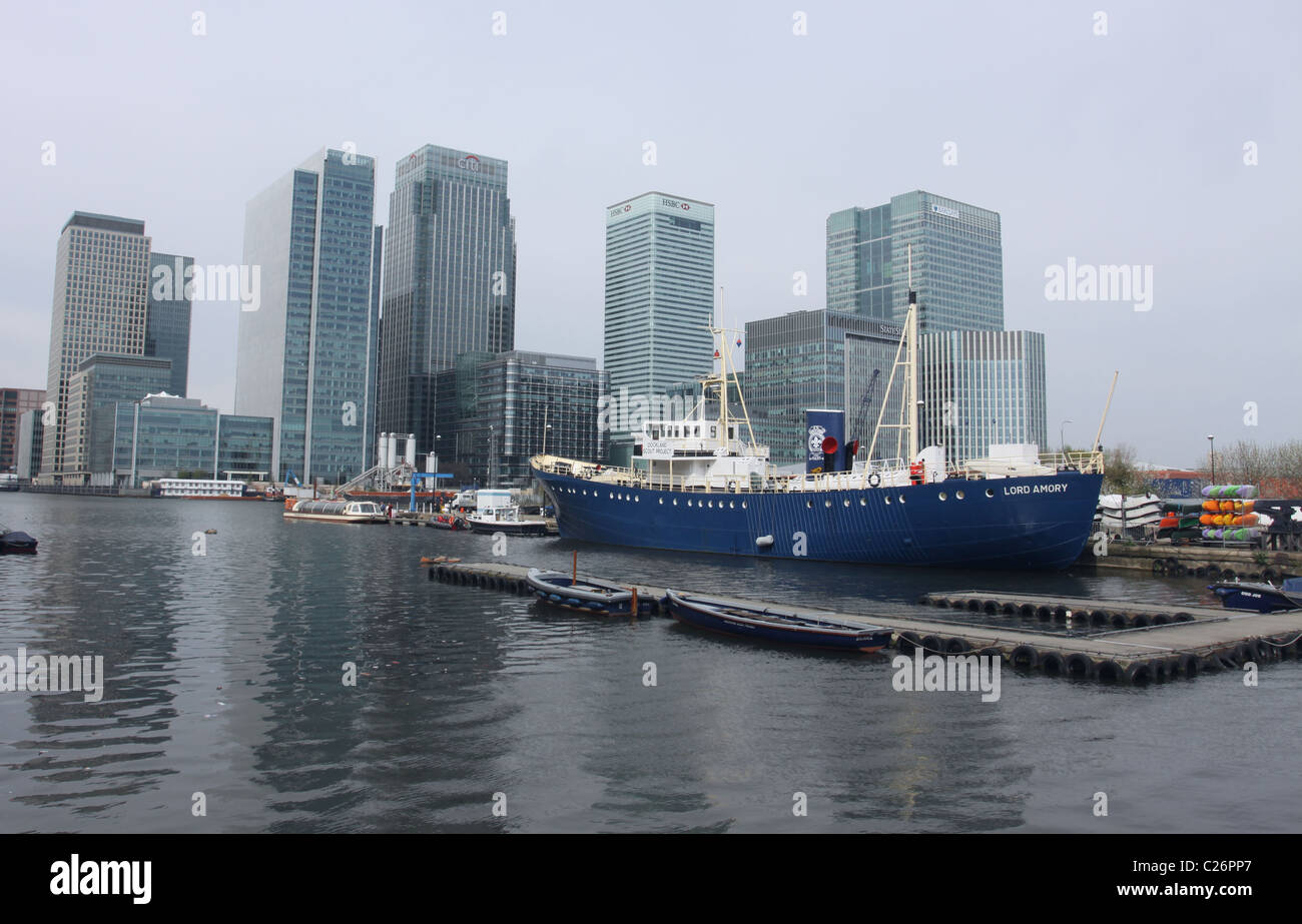 Docklands skyline reflected in West India Millwall docks London England ...