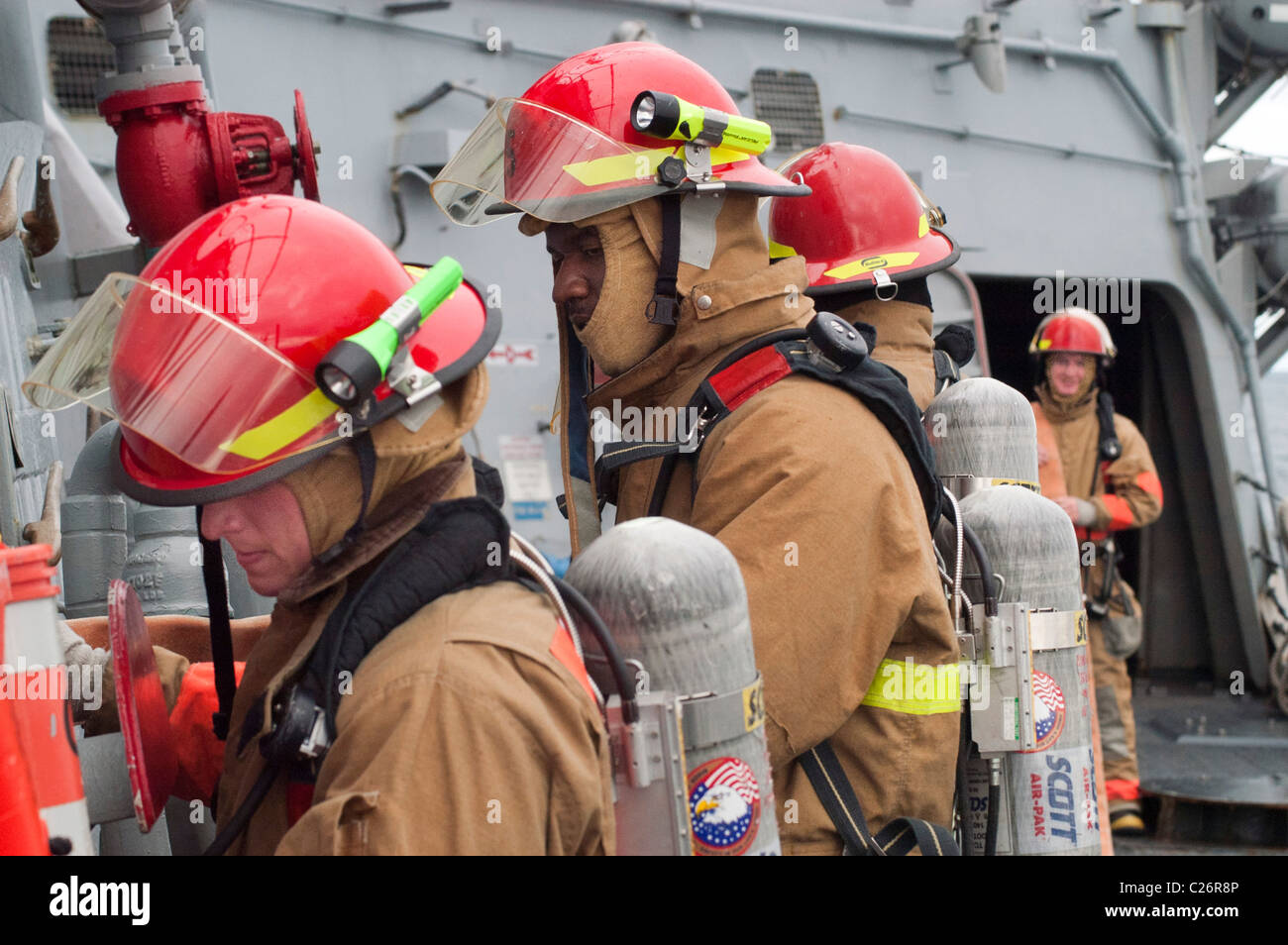 US Navy damage control party preparing to carry out a damage control ...