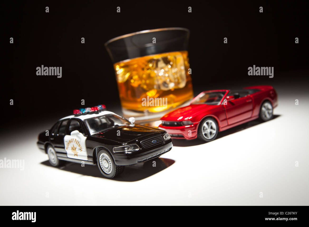 Police and Sports Car Next to Alcoholic Drink Under Spot Light Stock ...