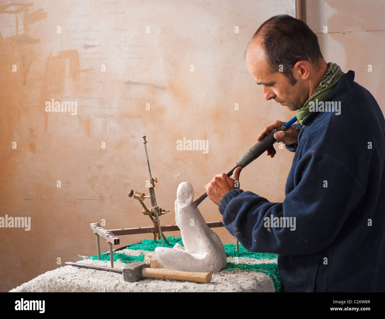 Sculptor working on his art at his workshop Stock Photo - Alamy